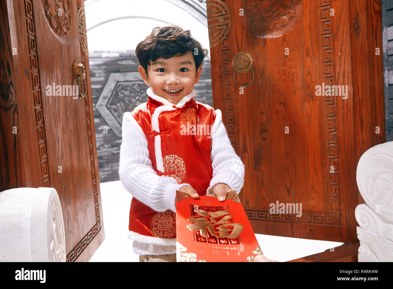 Lovely boy with a red envelope Stock Photo - Alamy