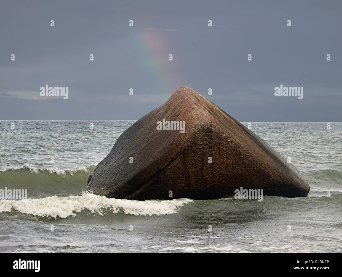obelisk in the sea,in thunderstorm mood and rainbow Stock Photo - Alamy