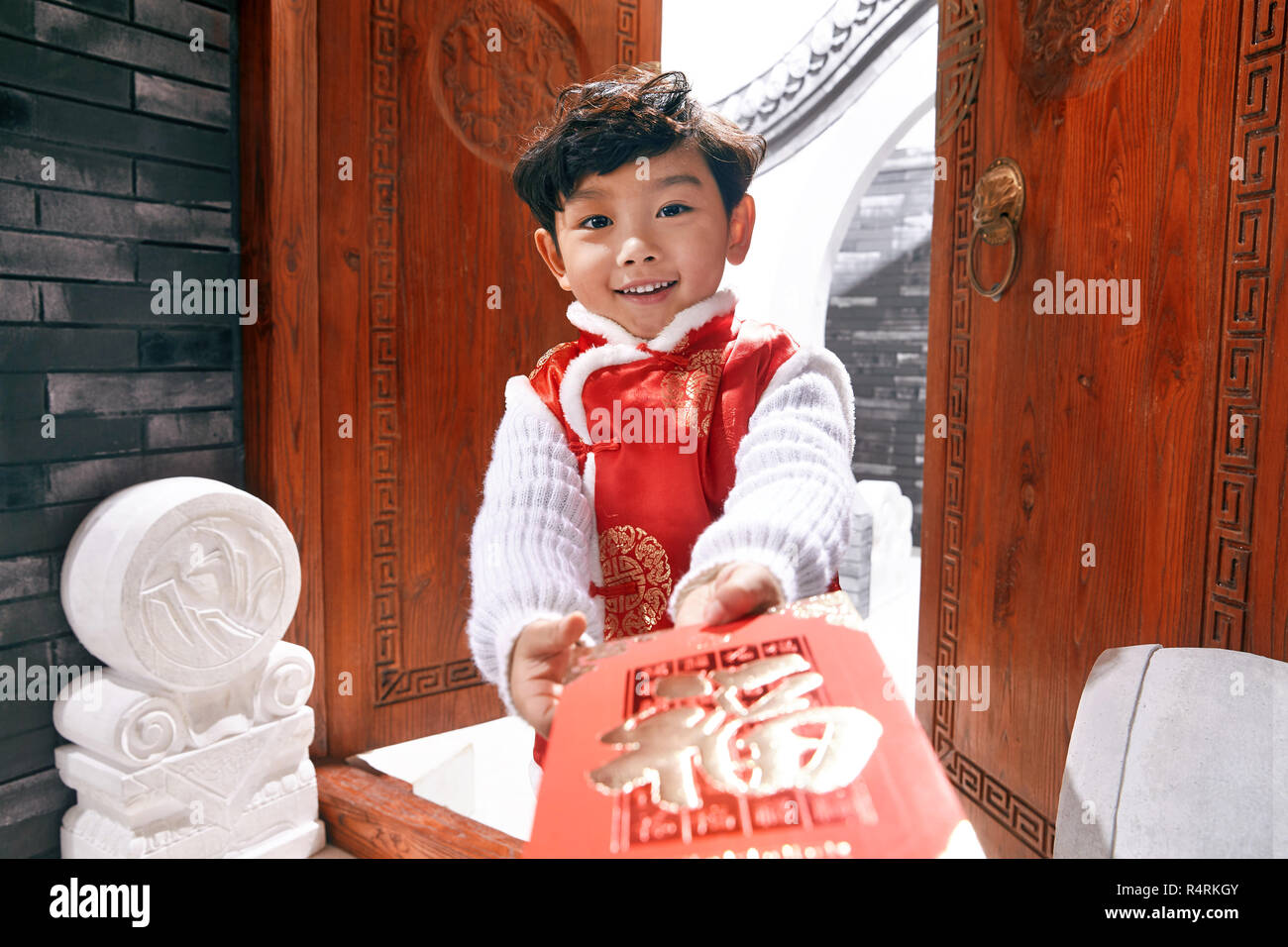 Lovely boy with a red envelope Stock Photo - Alamy