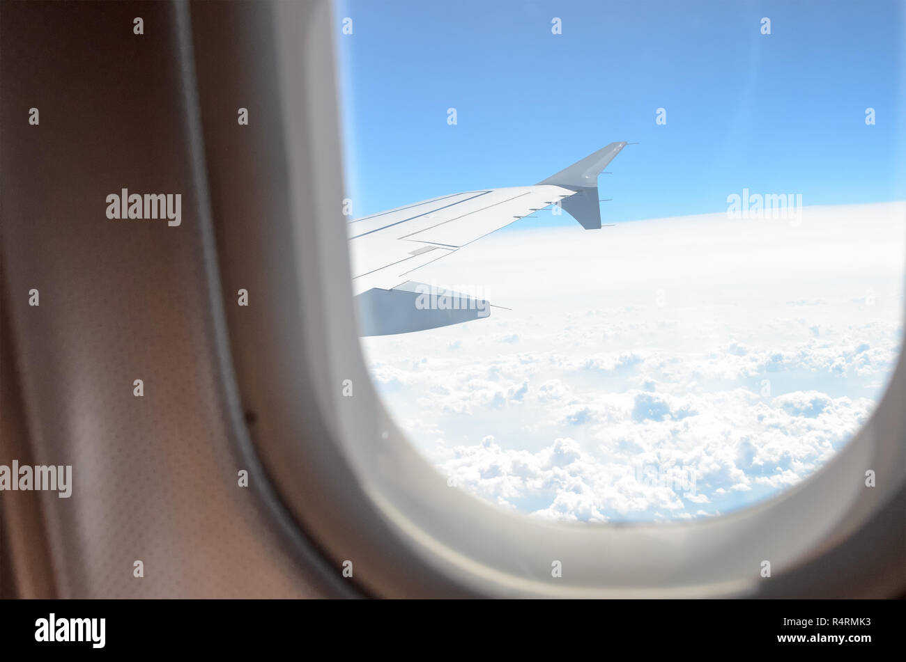 High above the clouds: View through the window of an aircraft Stock ...
