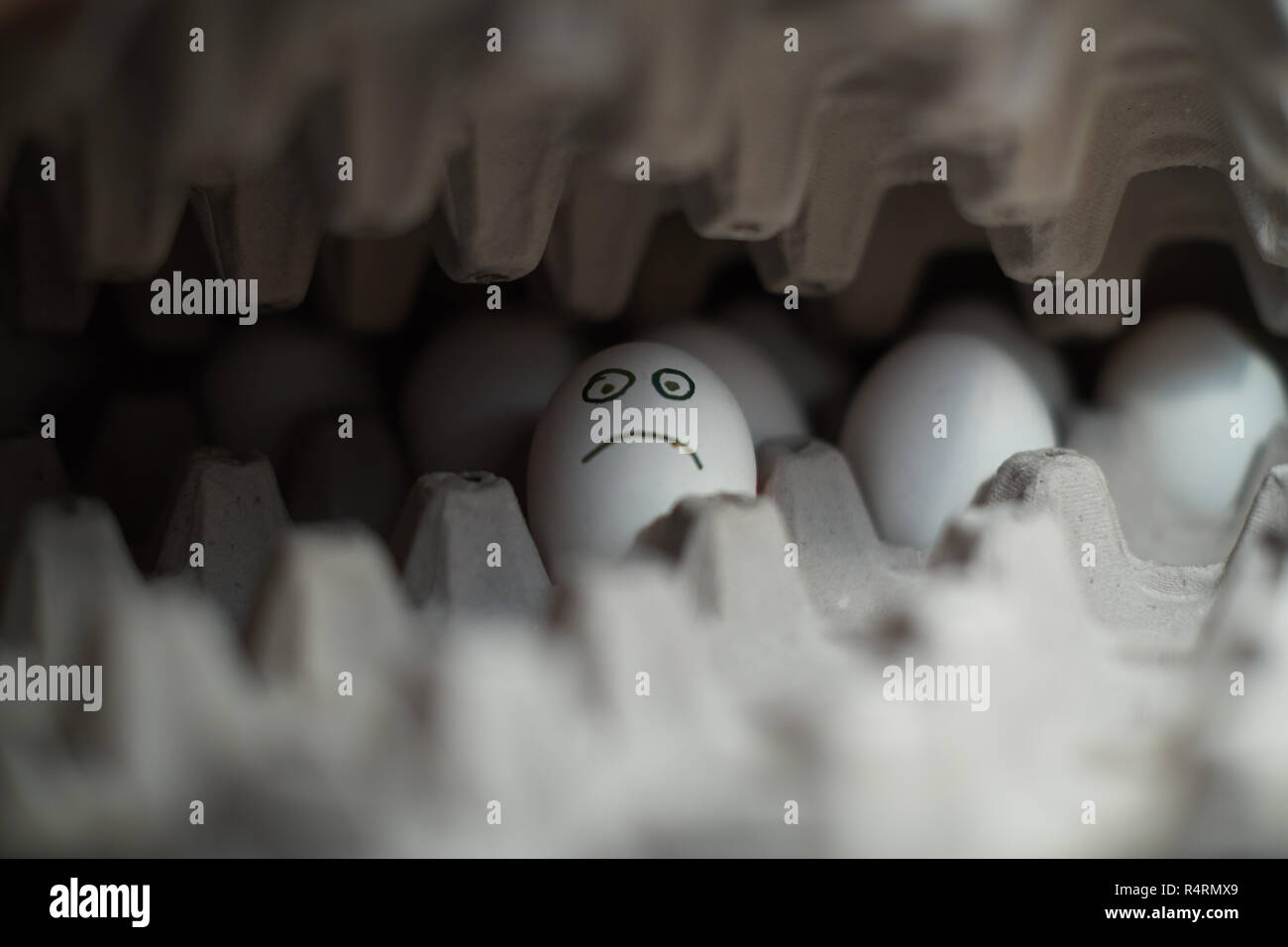 Egg with sad face Stock Photo - Alamy