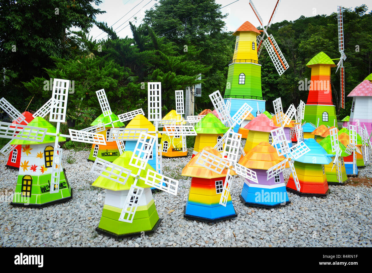garden colorful windmill wind turbine in the park garden - landscape ...