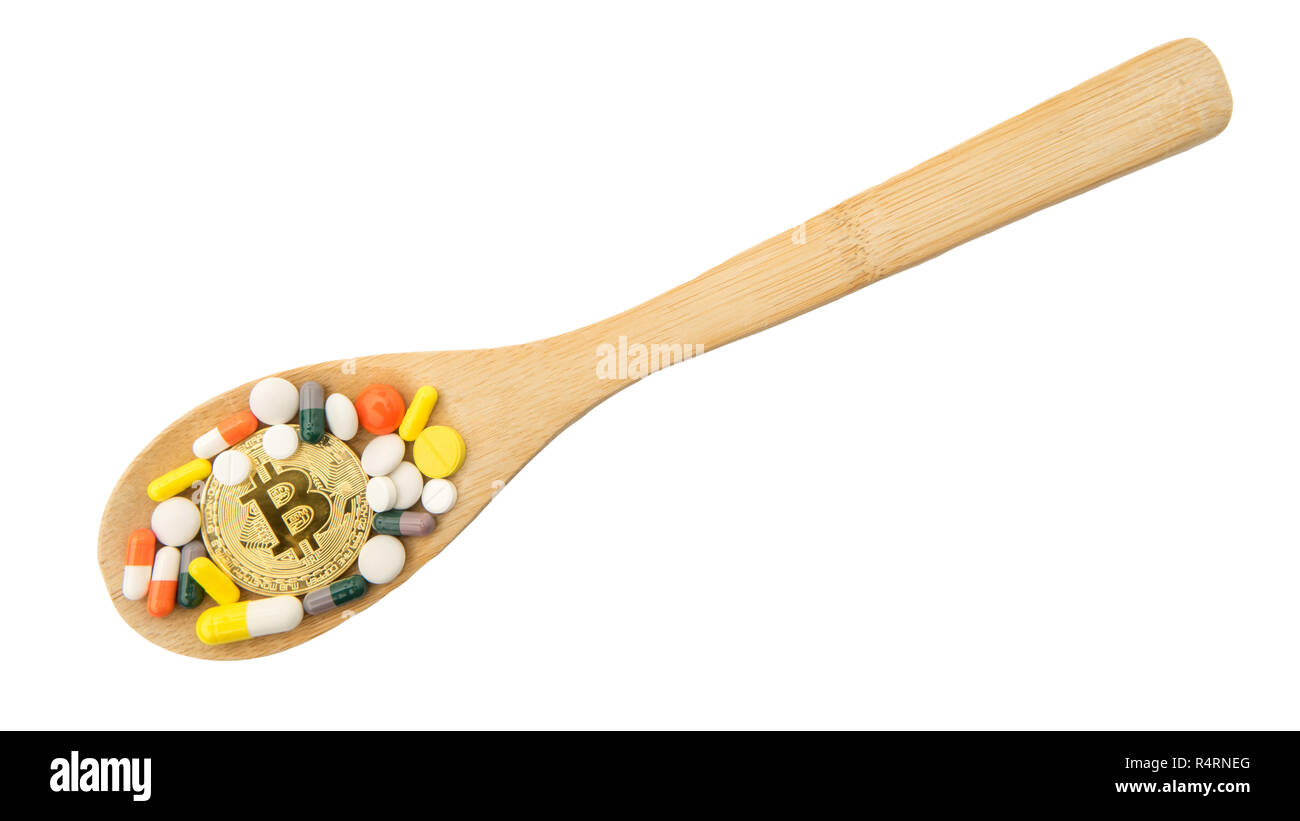 Top view of bitcoin, assorted pharmaceutical medicine pills, tablets on ...