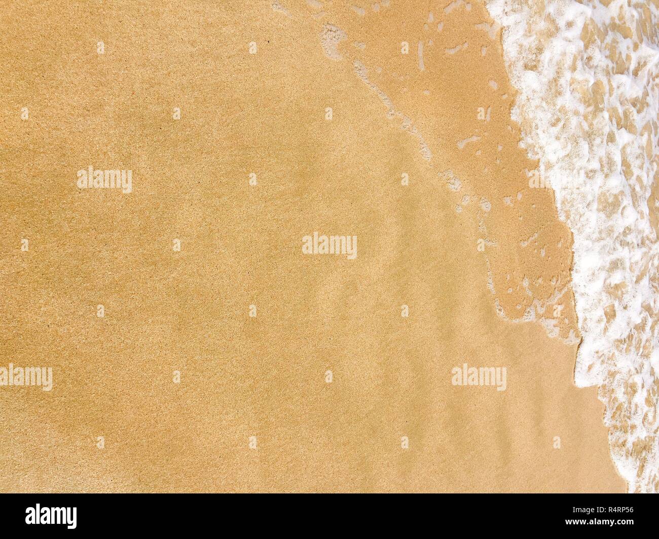 Sea waves reaching lapping to shore Stock Photo - Alamy