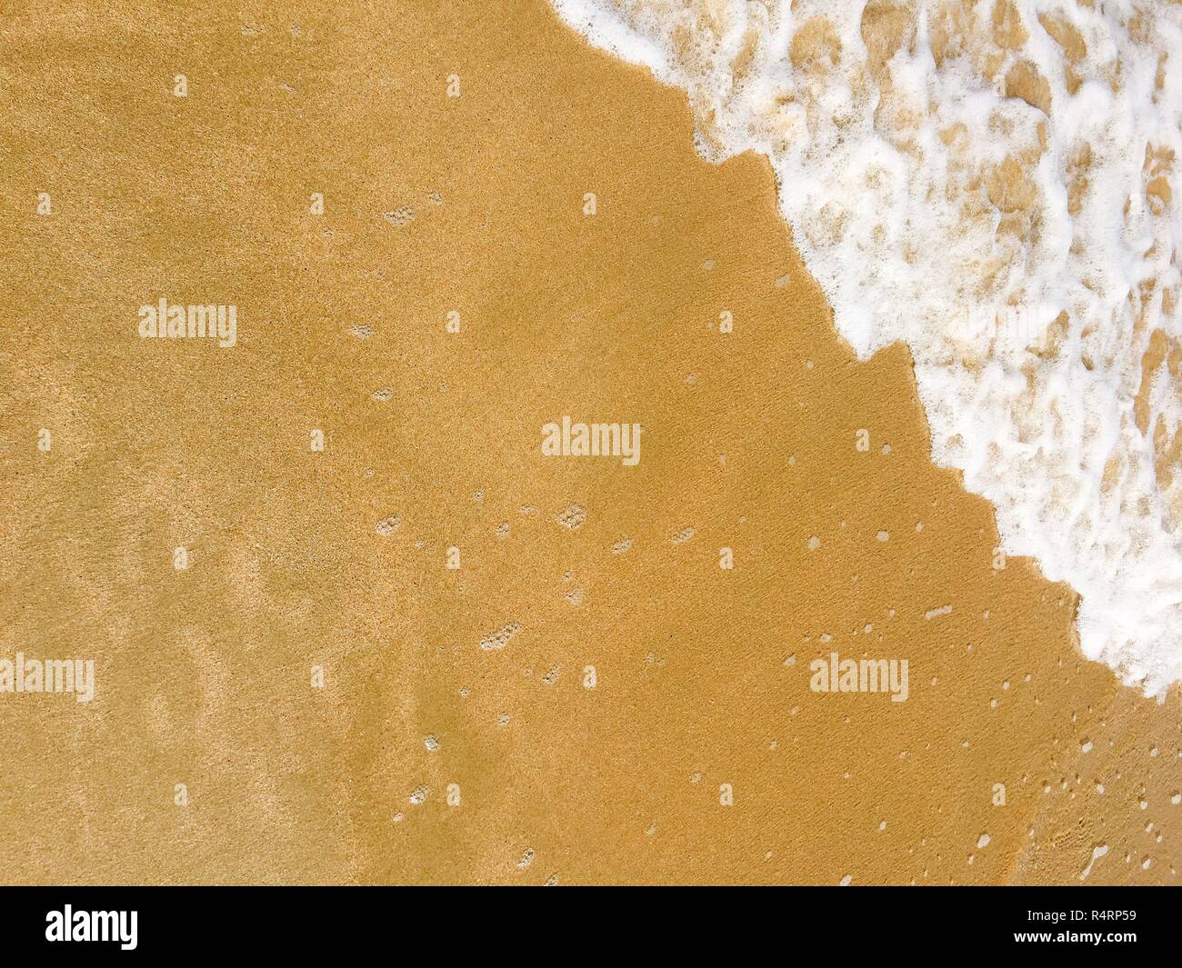 Sea waves reaching lapping to shore Stock Photo - Alamy