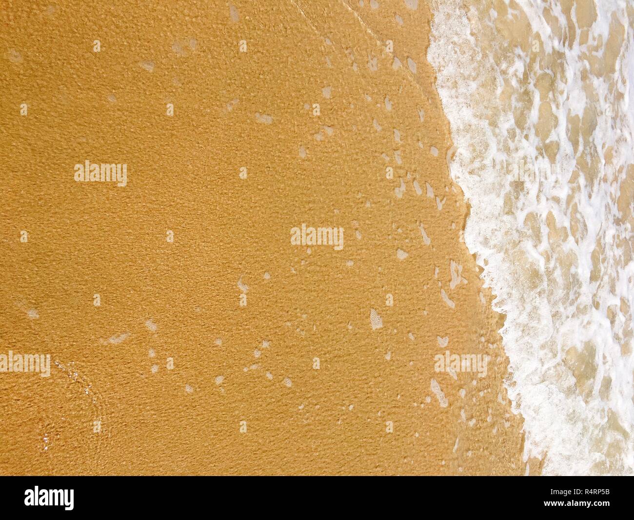 Sea waves reaching lapping to shore Stock Photo - Alamy