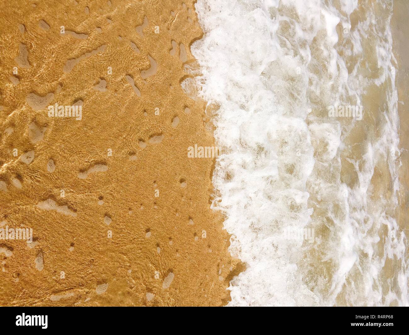Sea waves reaching lapping to shore Stock Photo - Alamy
