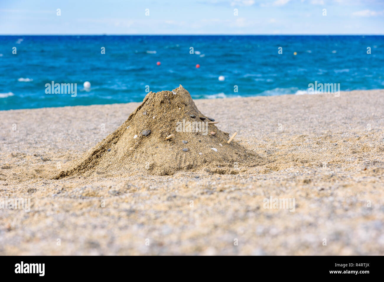 Volcano made from sand on the italian beach in Calabria Stock Photo - Alamy