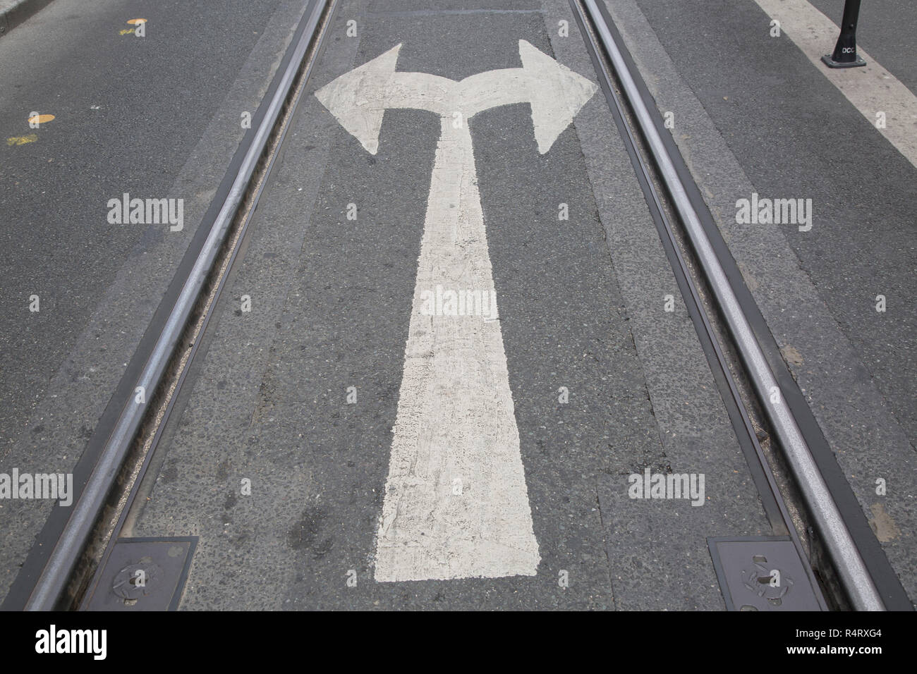 Double Direction Arrow Sign with Tram Tracks Stock Photo - Alamy