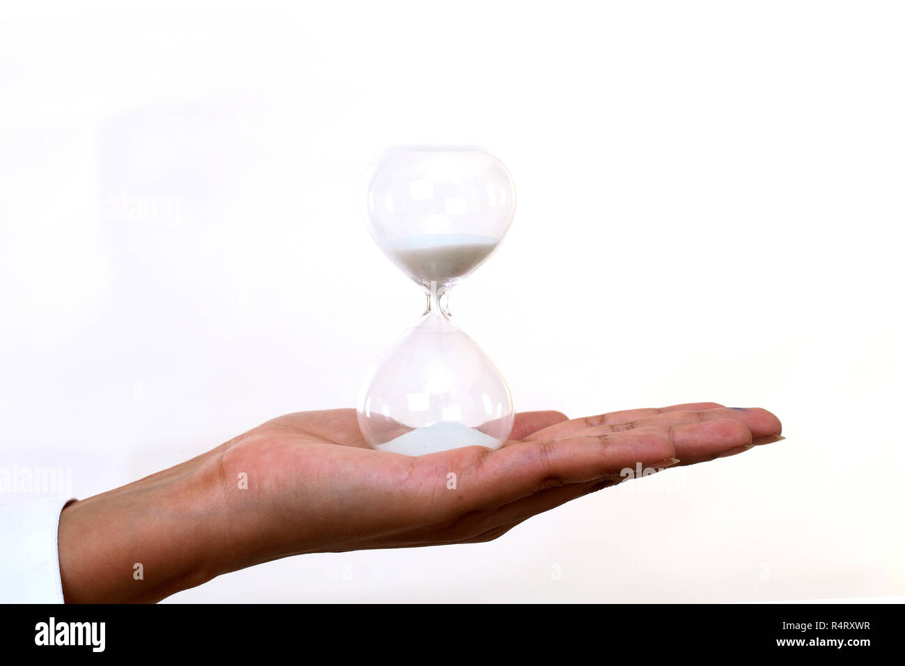 Holding sand timer hi-res stock photography and images - Alamy