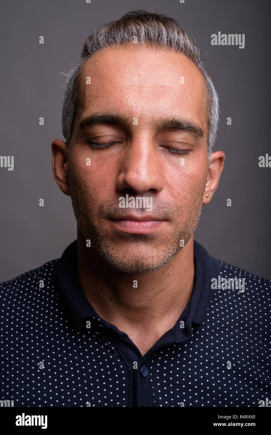 Face of handsome Persian man with gray hair eyes closed Stock Photo - Alamy