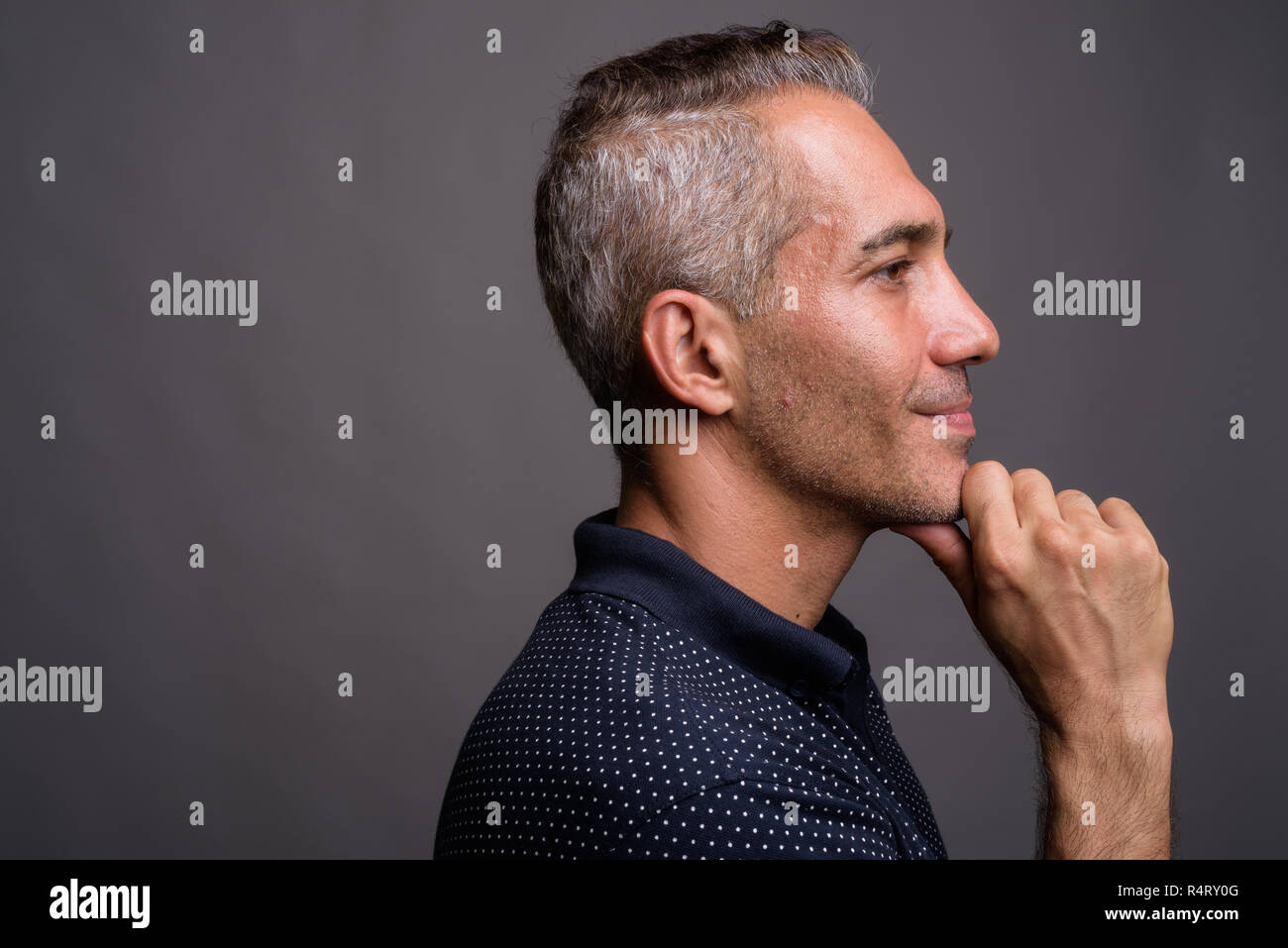 Face of handsome Persian man profile view while thinking Stock Photo ...