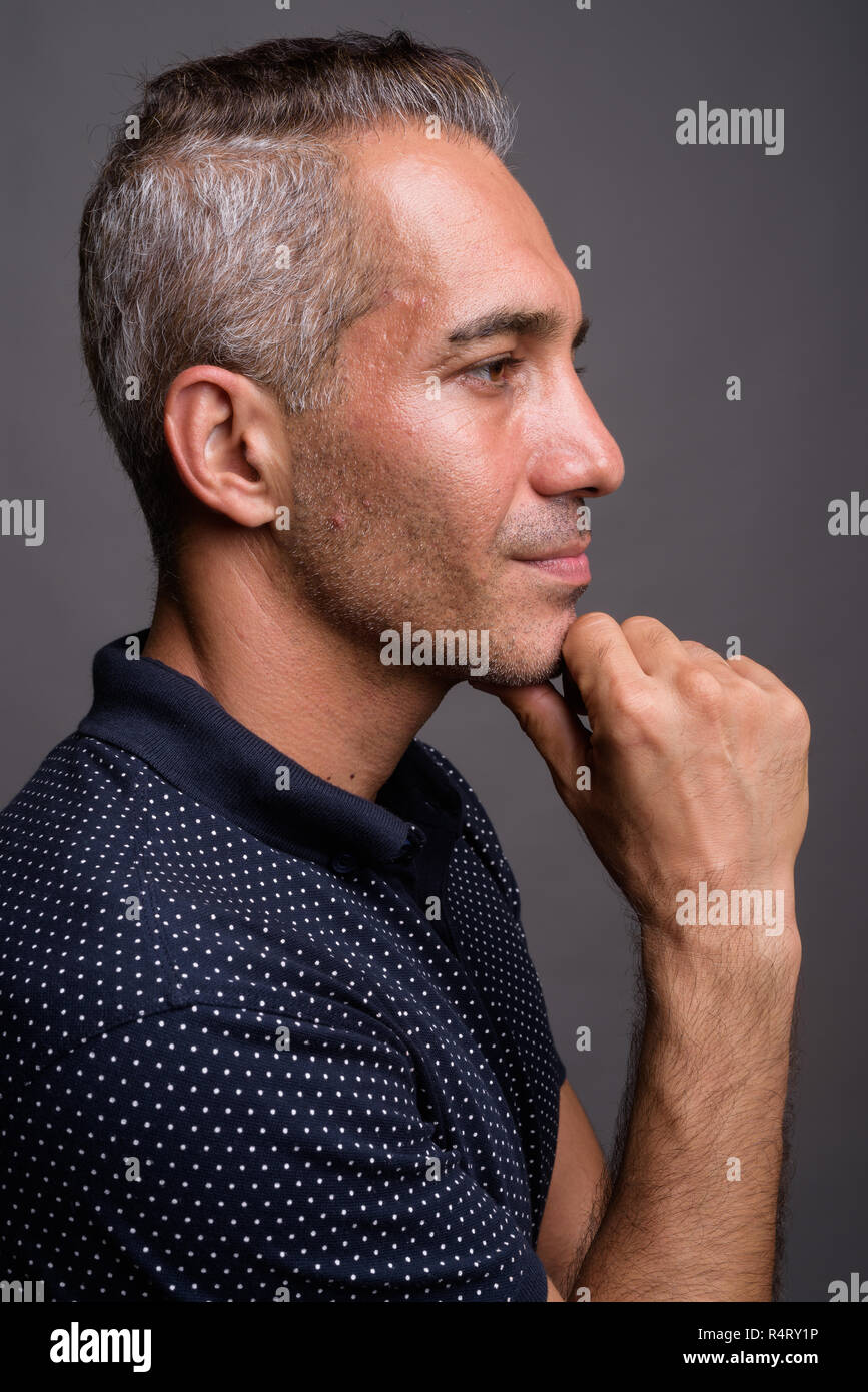 Face of handsome Persian man profile view while thinking Stock Photo ...