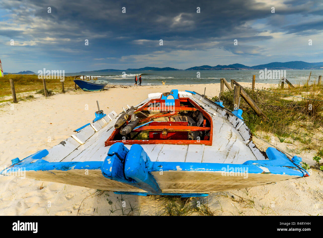 A collection of fishing boats on a small beach in Vigo - Galicia, Spain ...