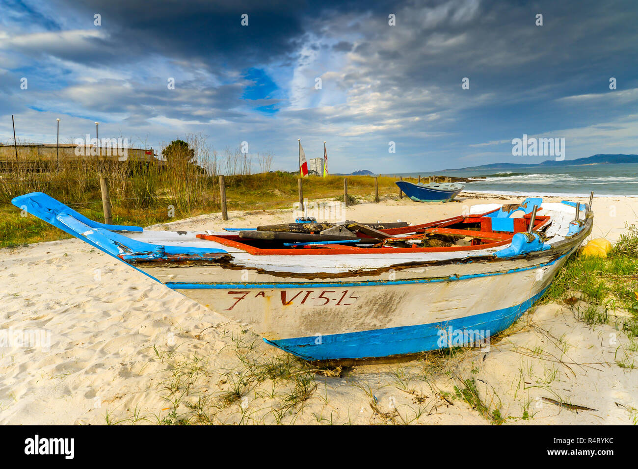 A collection of fishing boats on a small beach in Vigo - Galicia, Spain ...