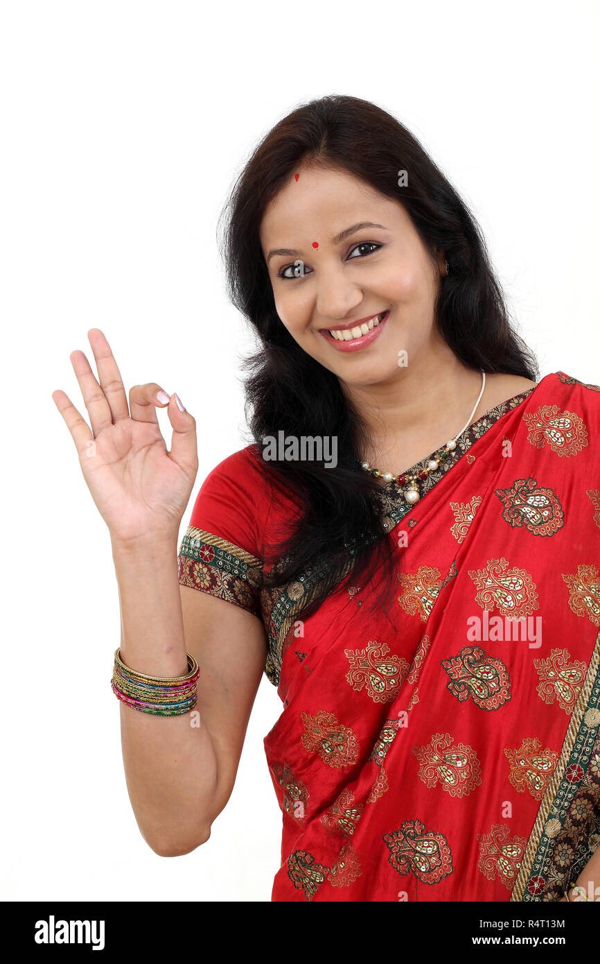 Happy traditional Indian woman making ok gesture Stock Photo - Alamy