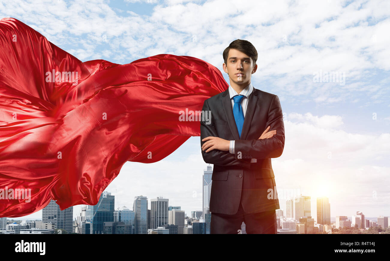 Concept of power and sucess with businessman superhero in big city ...