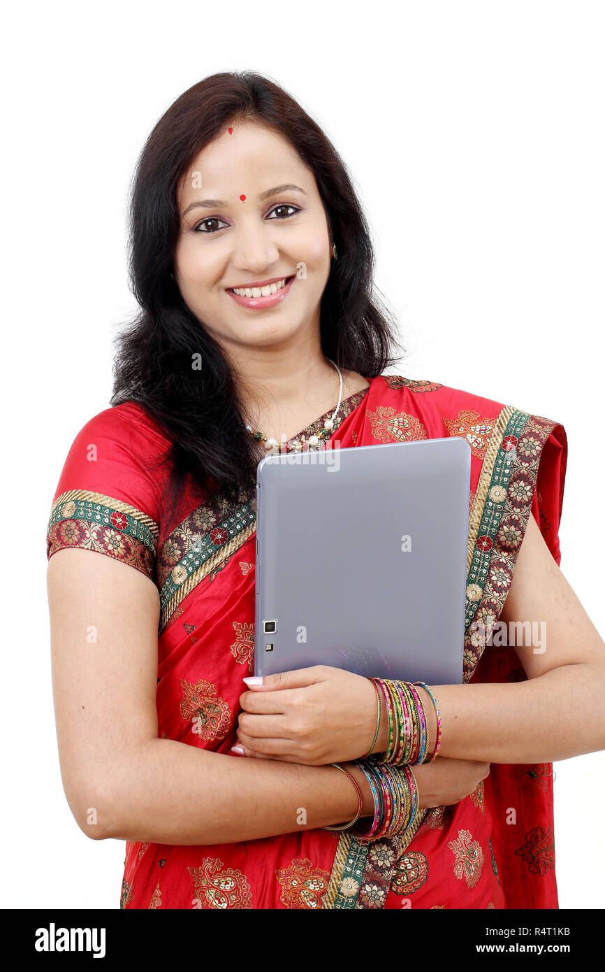 Traditional Indian woman holding a laptop computer Stock Photo - Alamy