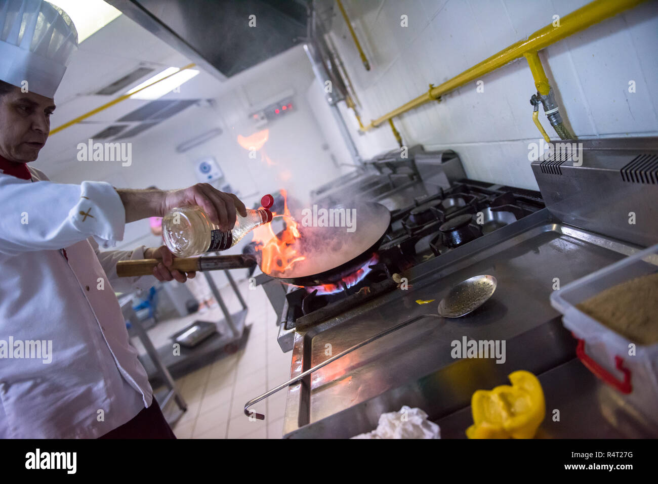 Cook working flaming pan hi-res stock photography and images - Alamy