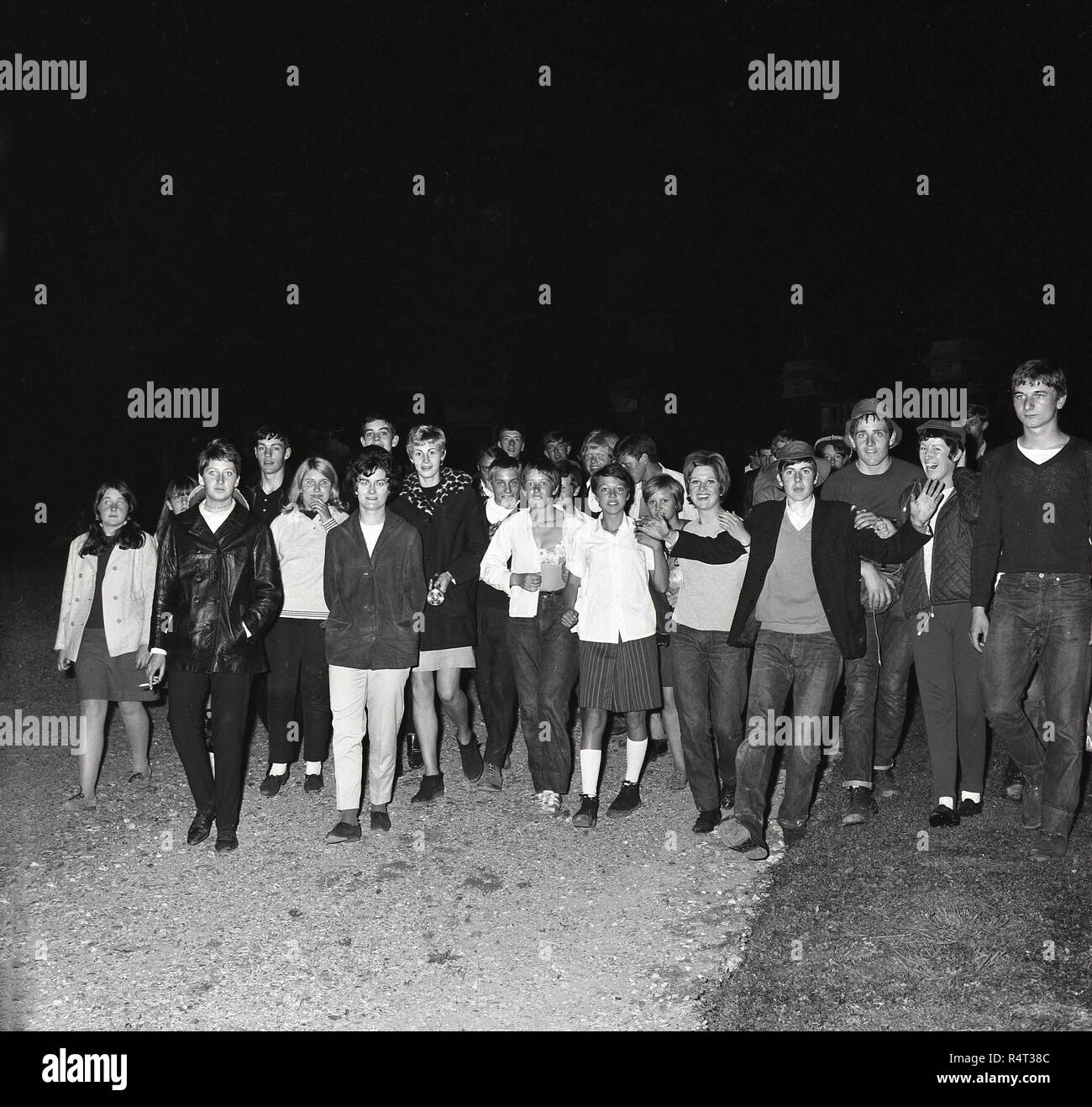 1965, historical, a large group of young people doing a charity ...