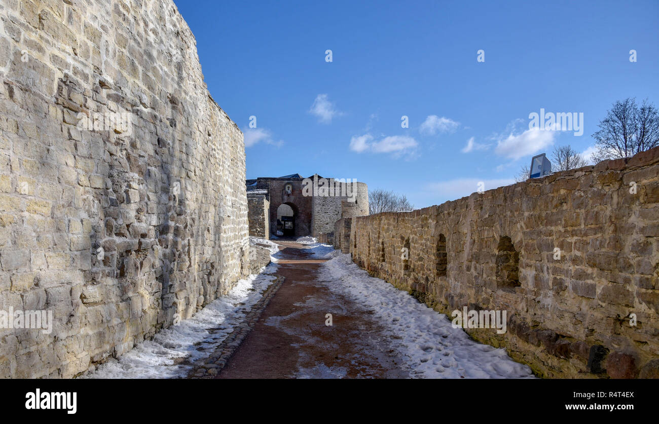The wall of an ancient medieval fortress on a sunny day in early spring ...