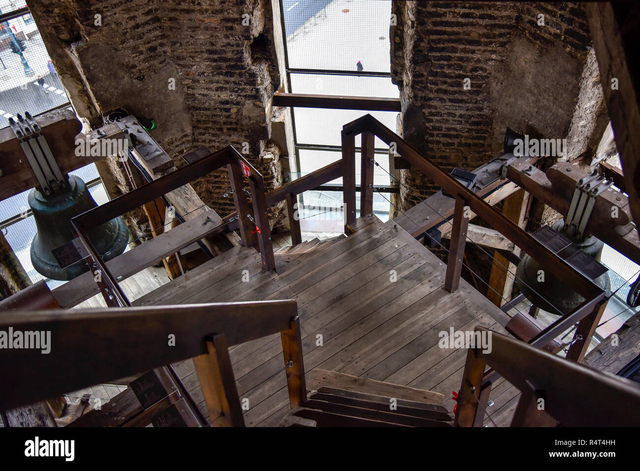 Inside the tower with bells of the ancient city architecture, chair ...