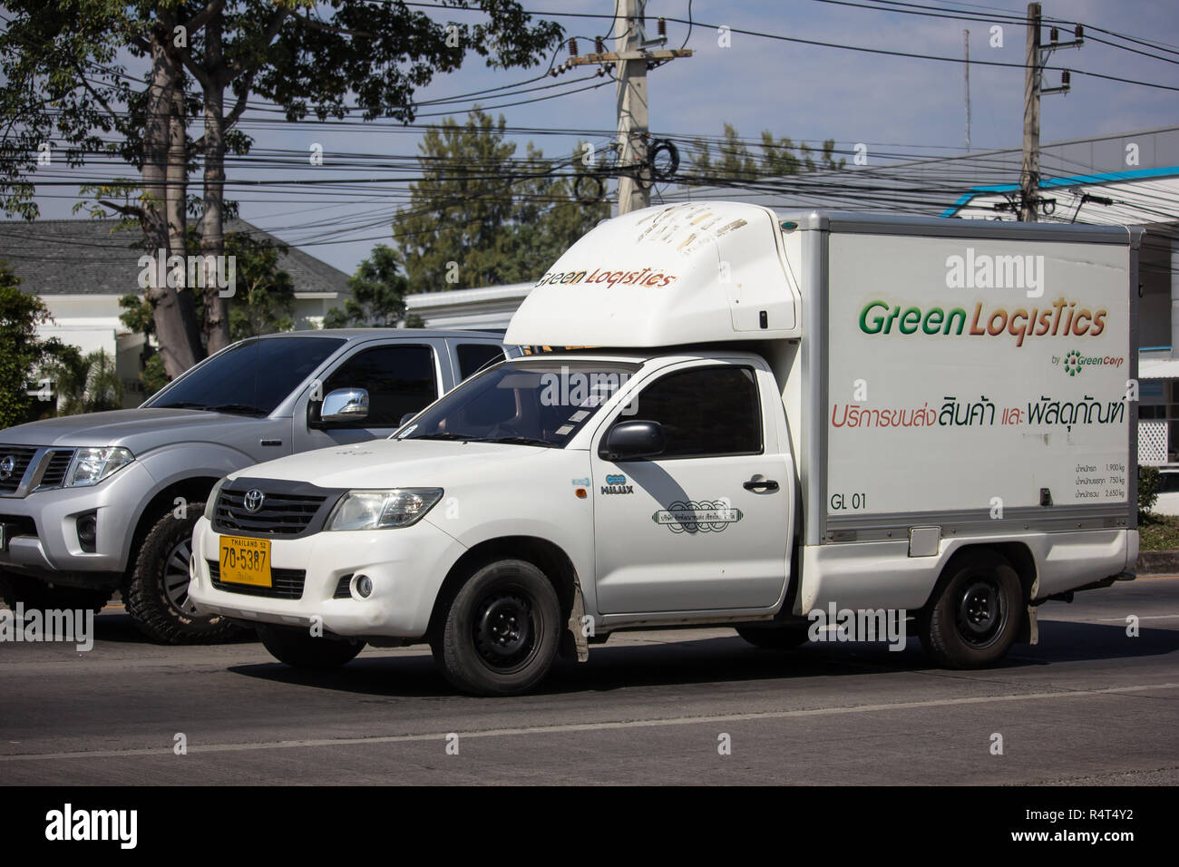 CHIANG MAI, THAILAND -DECEMBER 12 2017: Green Logistics mini truck. Photo at road no 121 about 8 ...