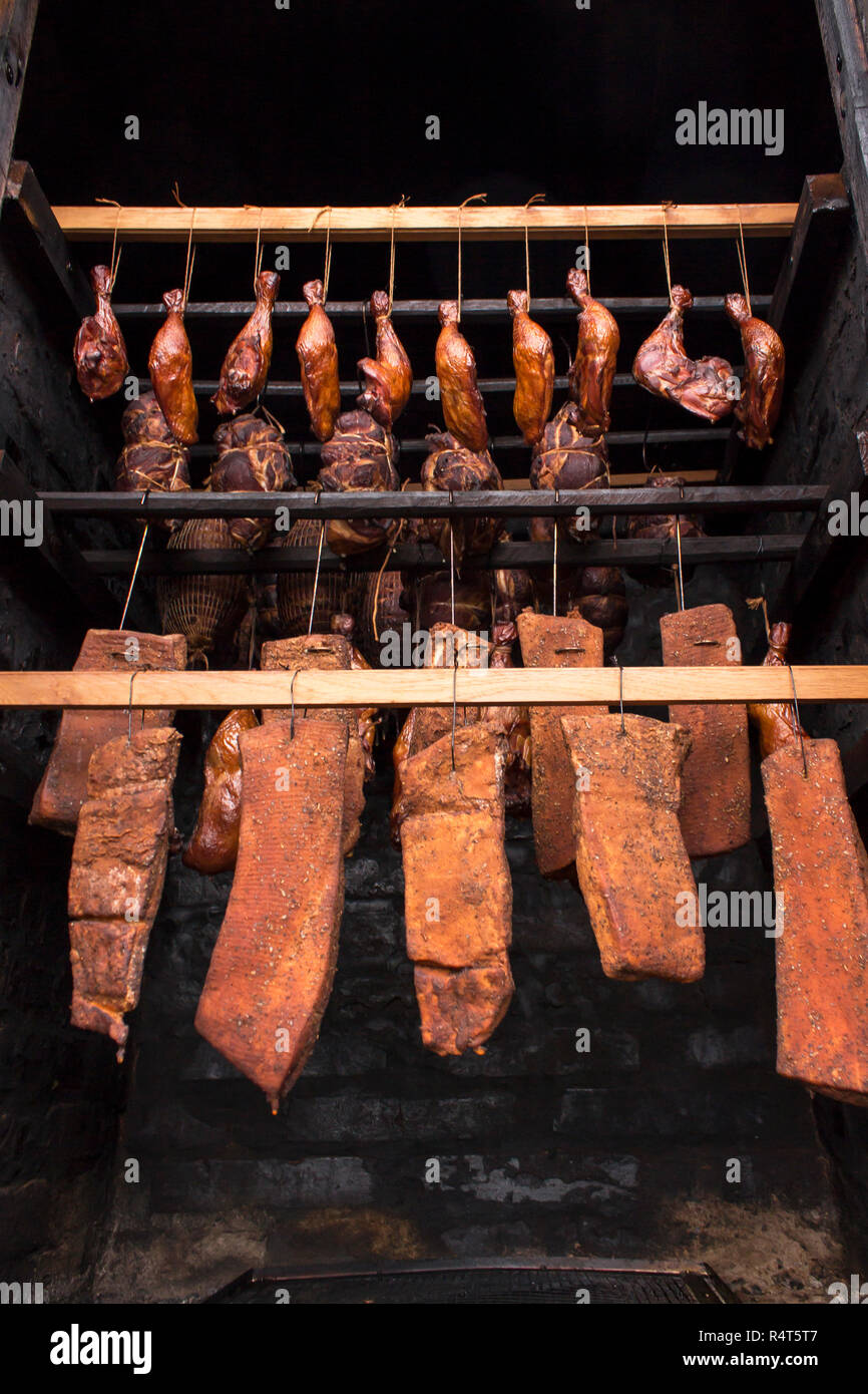stages of smoking. ready-smoked meat in the smokehouse Stock Photo - Alamy