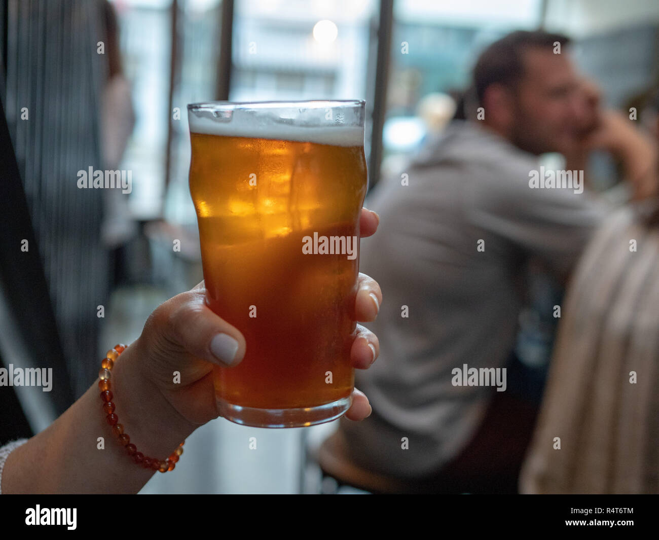 Woman serving beer hi-res stock photography and images - Alamy