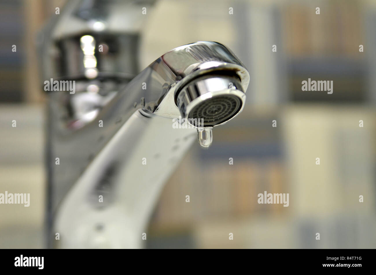 Bathroom tap leaking water drops Stock Photo - Alamy