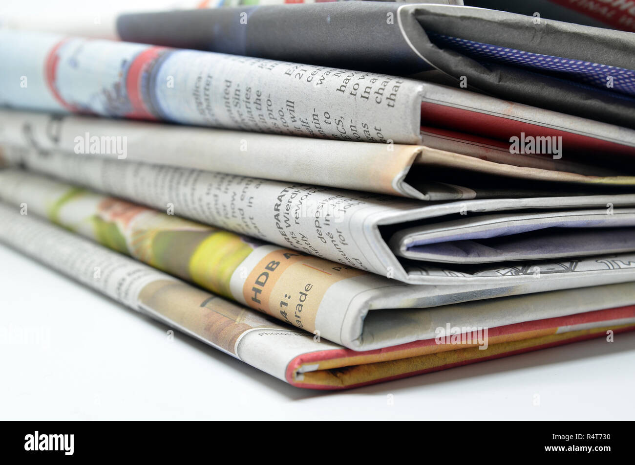 Newspapers folded and stacked Stock Photo - Alamy