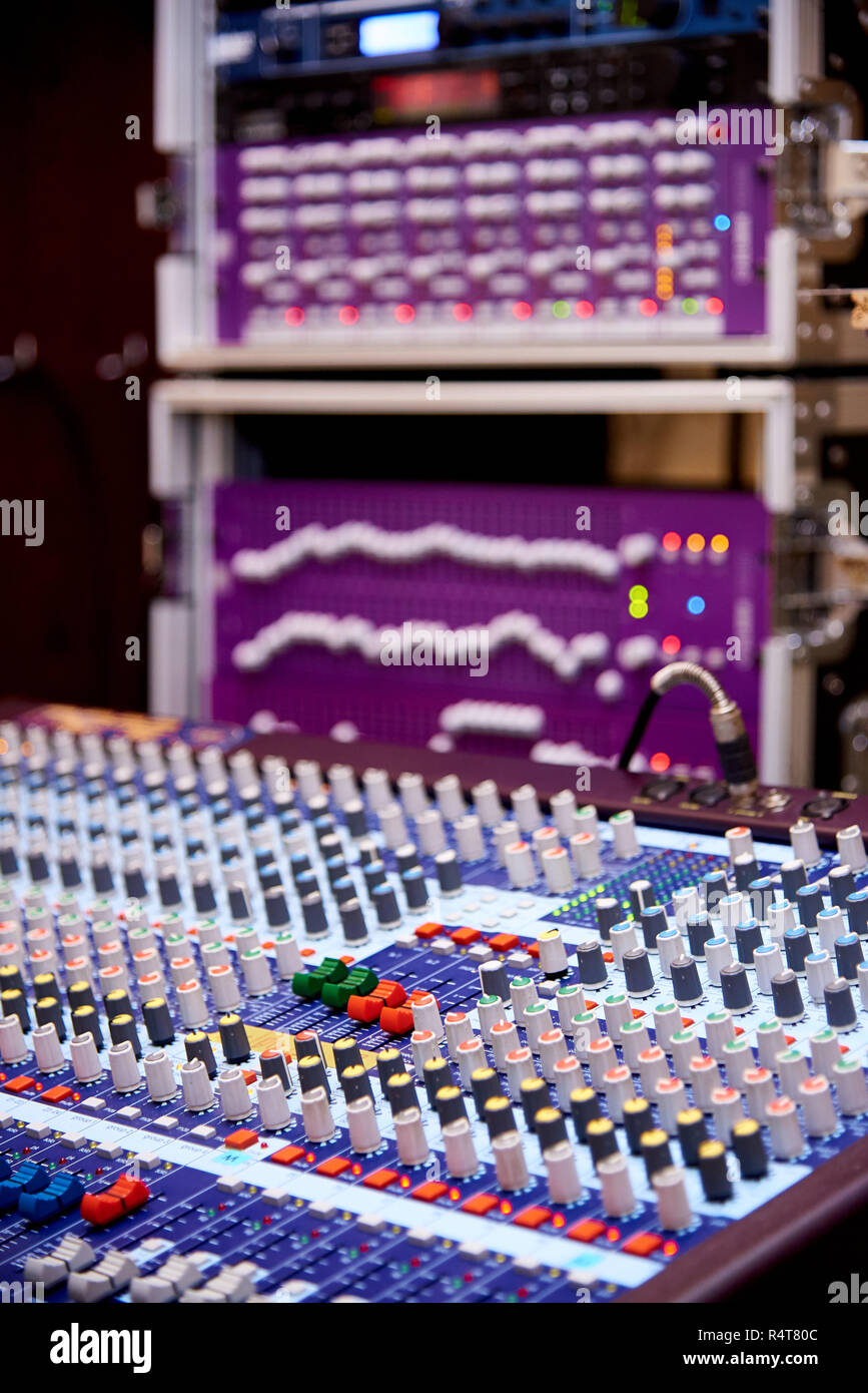 Professional sound and audio mixer control panel with buttons and ...