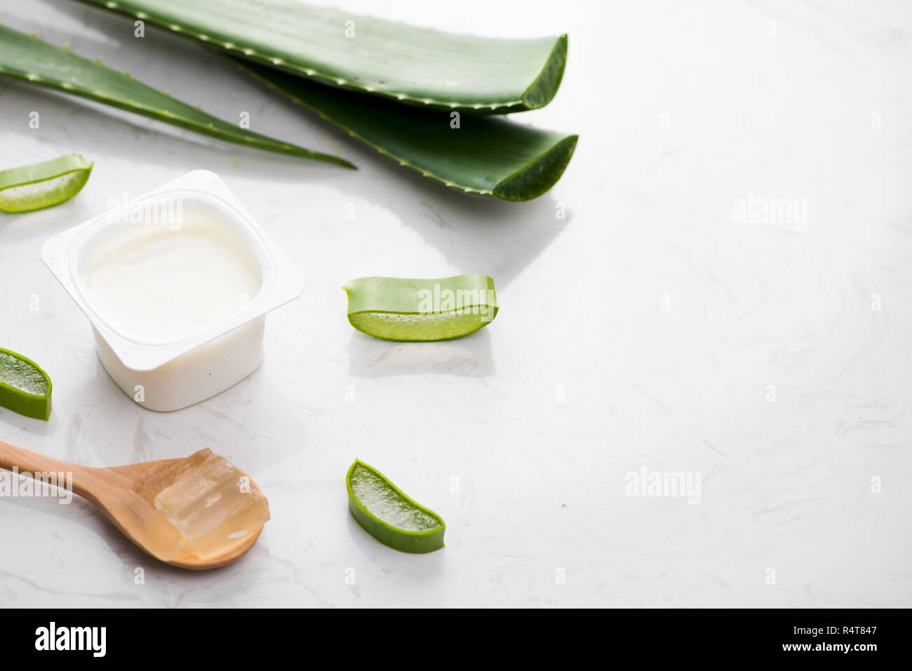 Aloe vera yogurt with fresh leaves on a wooden table Stock Photo - Alamy
