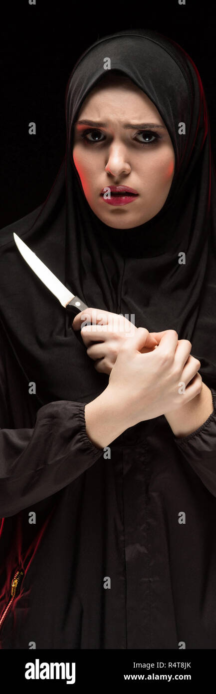 Portrait of beautiful desperate scared frightened young muslim woman ...