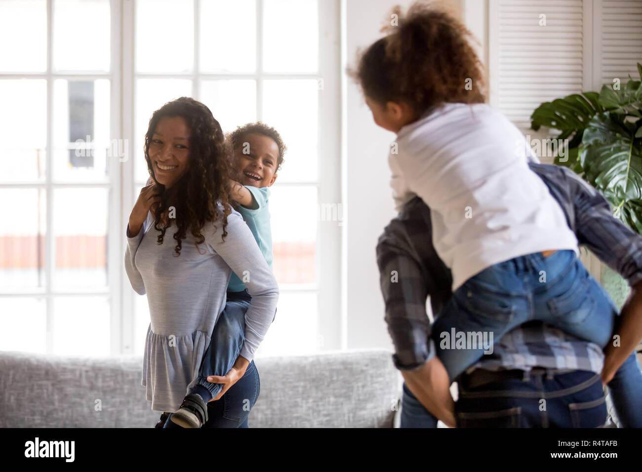 Happy African American family having fun together Stock Photo - Alamy