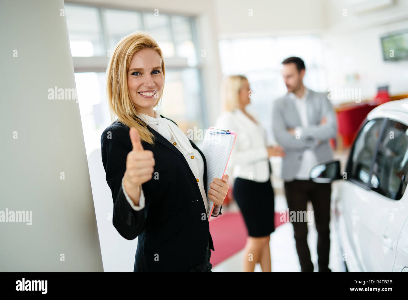Portrait of happy customer buying new car Stock Photo - Alamy