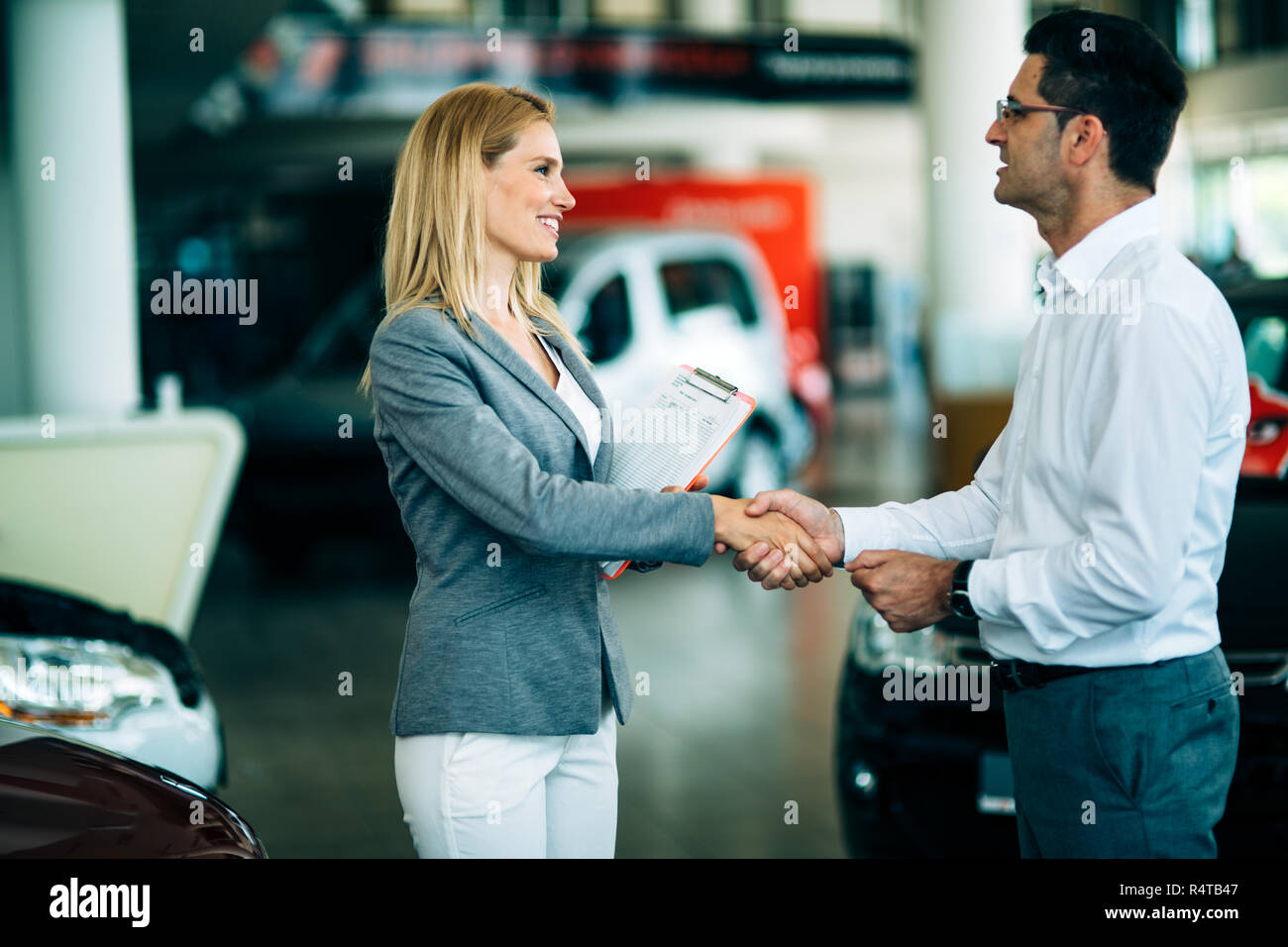 Portrait of happy customer buying new car Stock Photo - Alamy