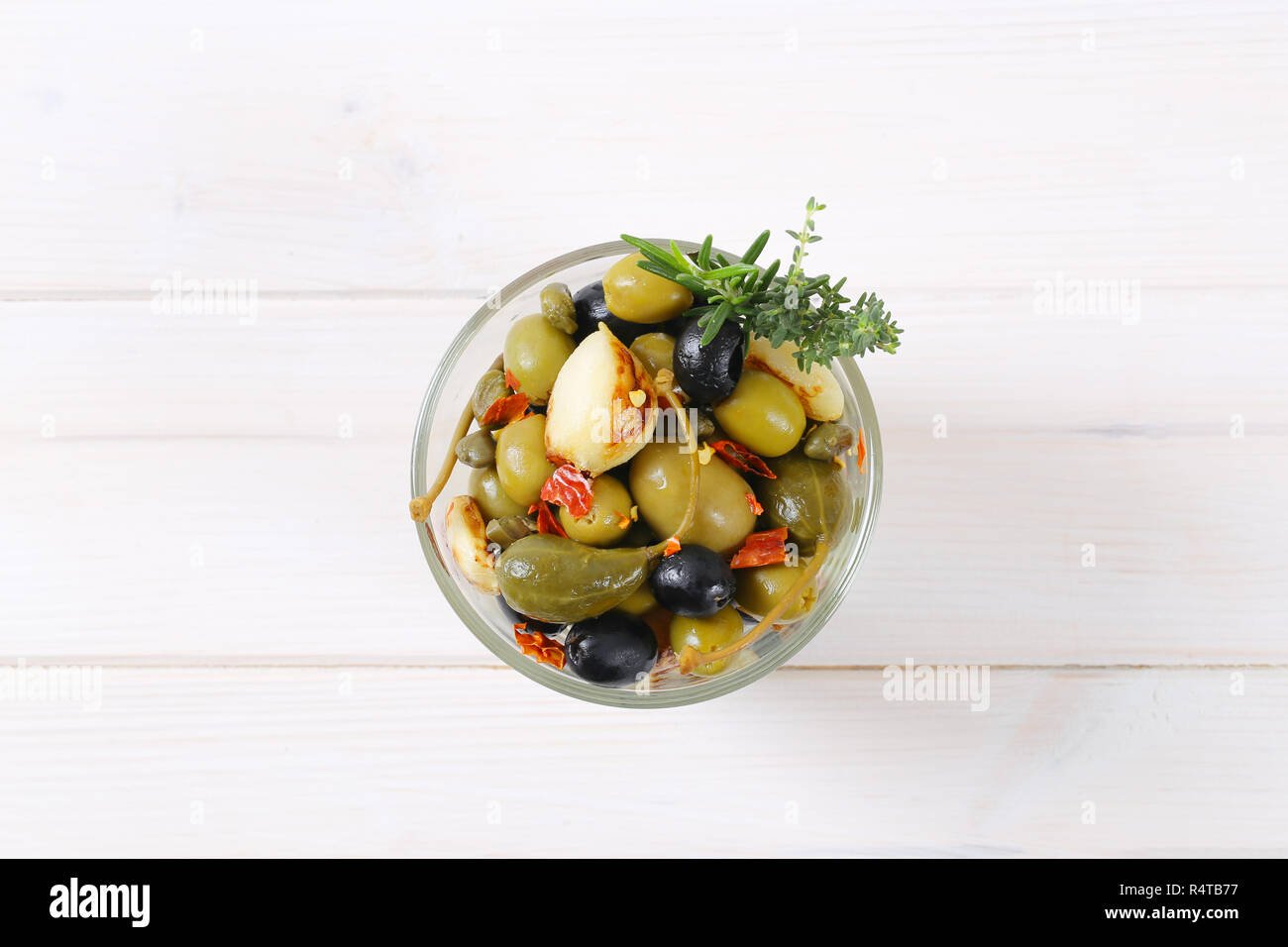 pickled olives, capers, caper berries and garlic Stock Photo - Alamy