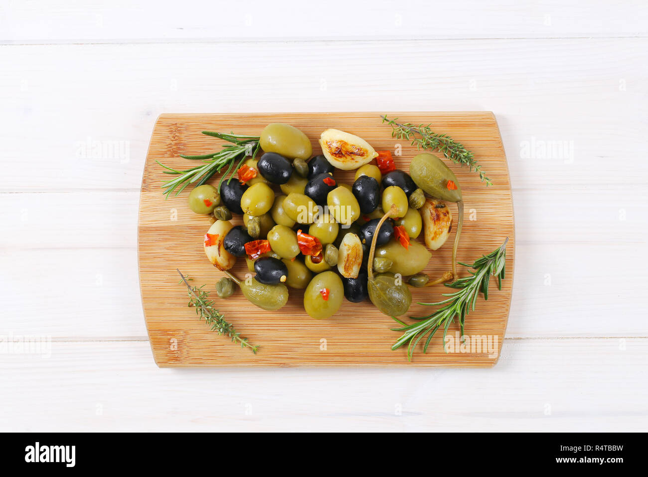 pickled olives, capers, caper berries and garlic Stock Photo - Alamy