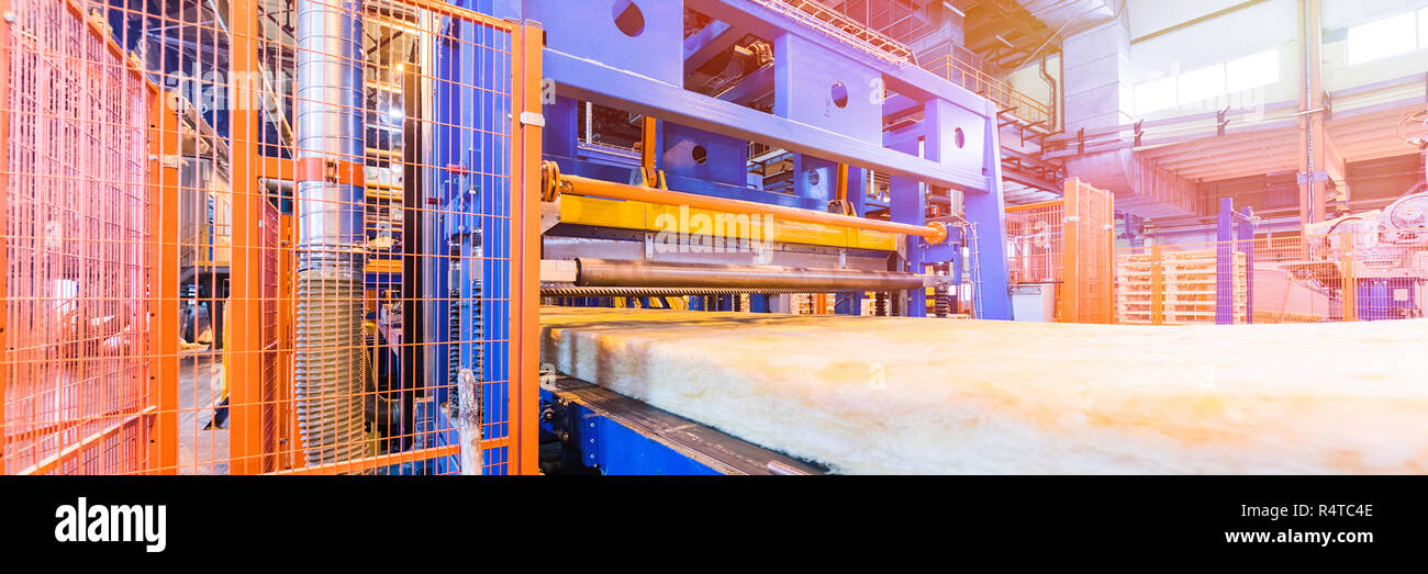 Fiberglass production industry equipment at manufacture background ...