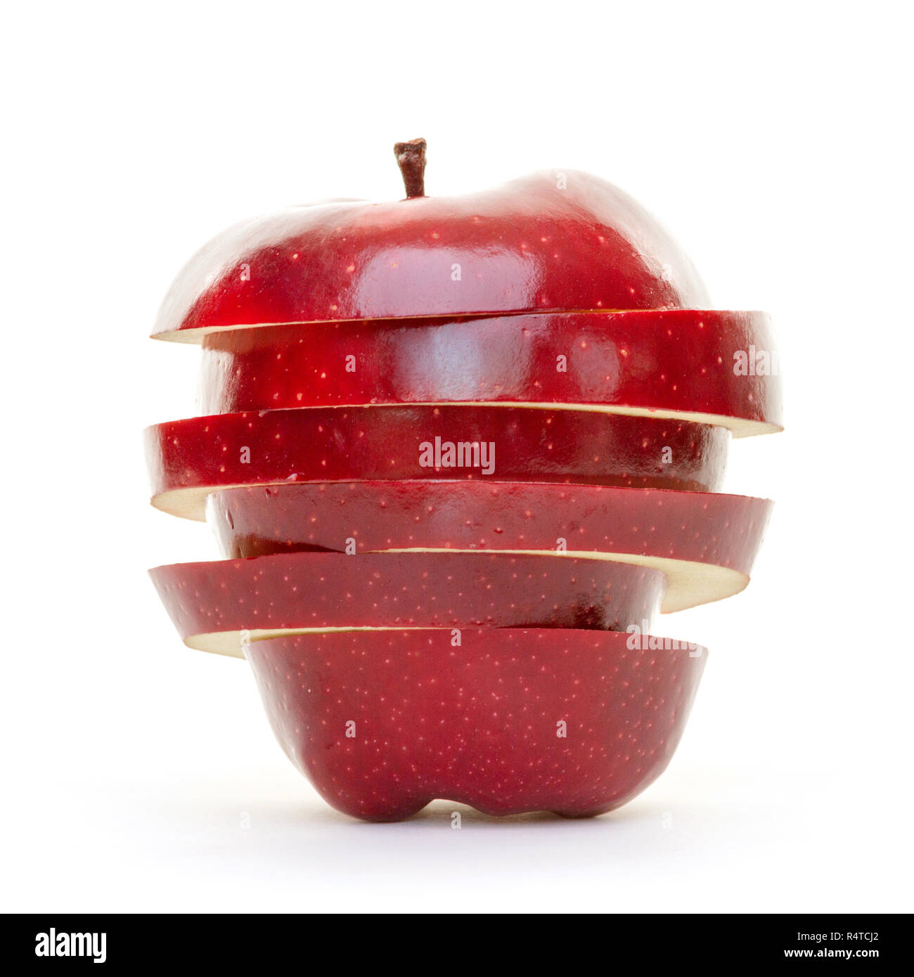 Red apple slices piled up and isolated on white background Stock Photo ...