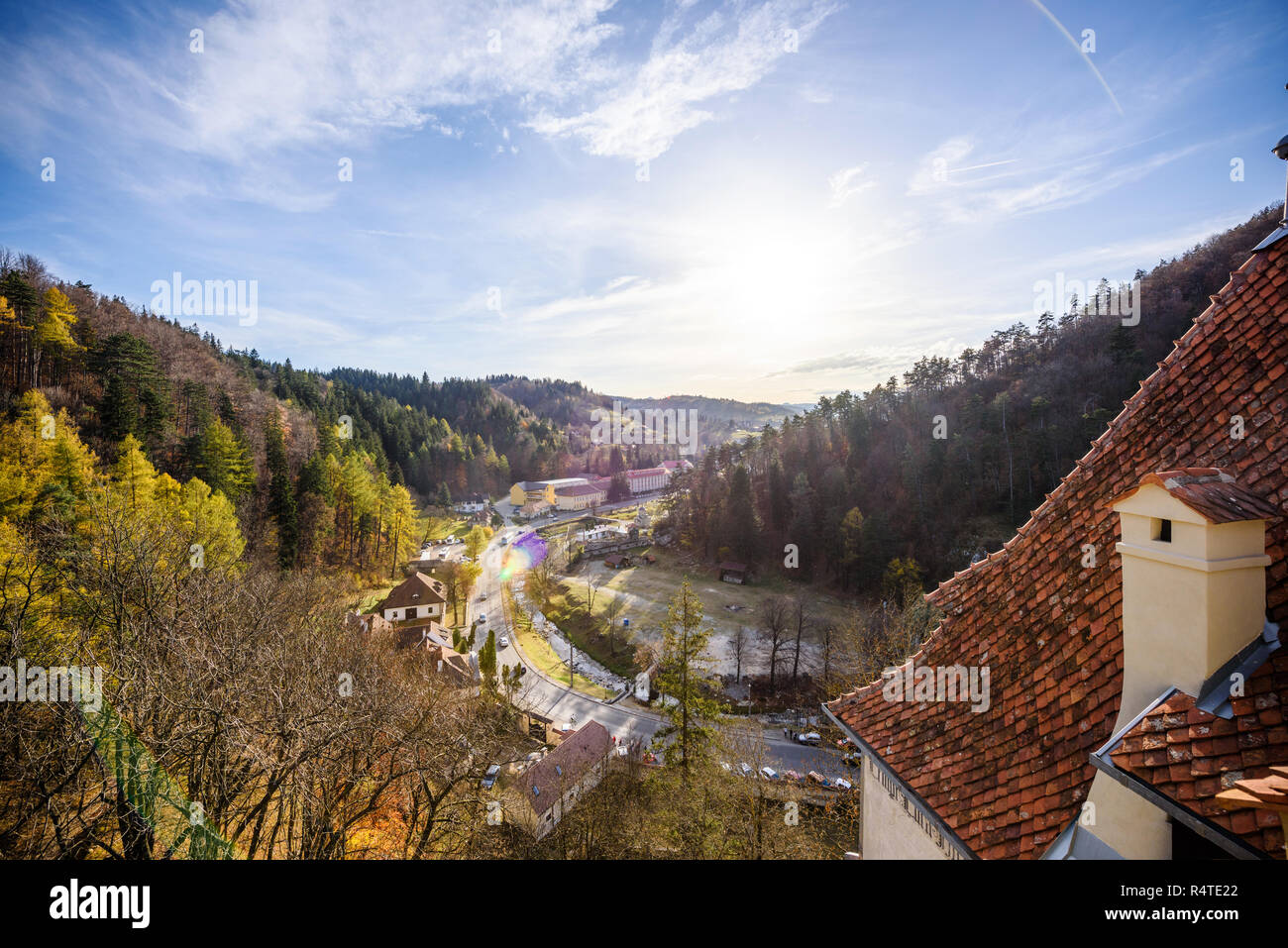 Bran city from castle view. Sun glowing at daylight. Blue sky. Romania ...