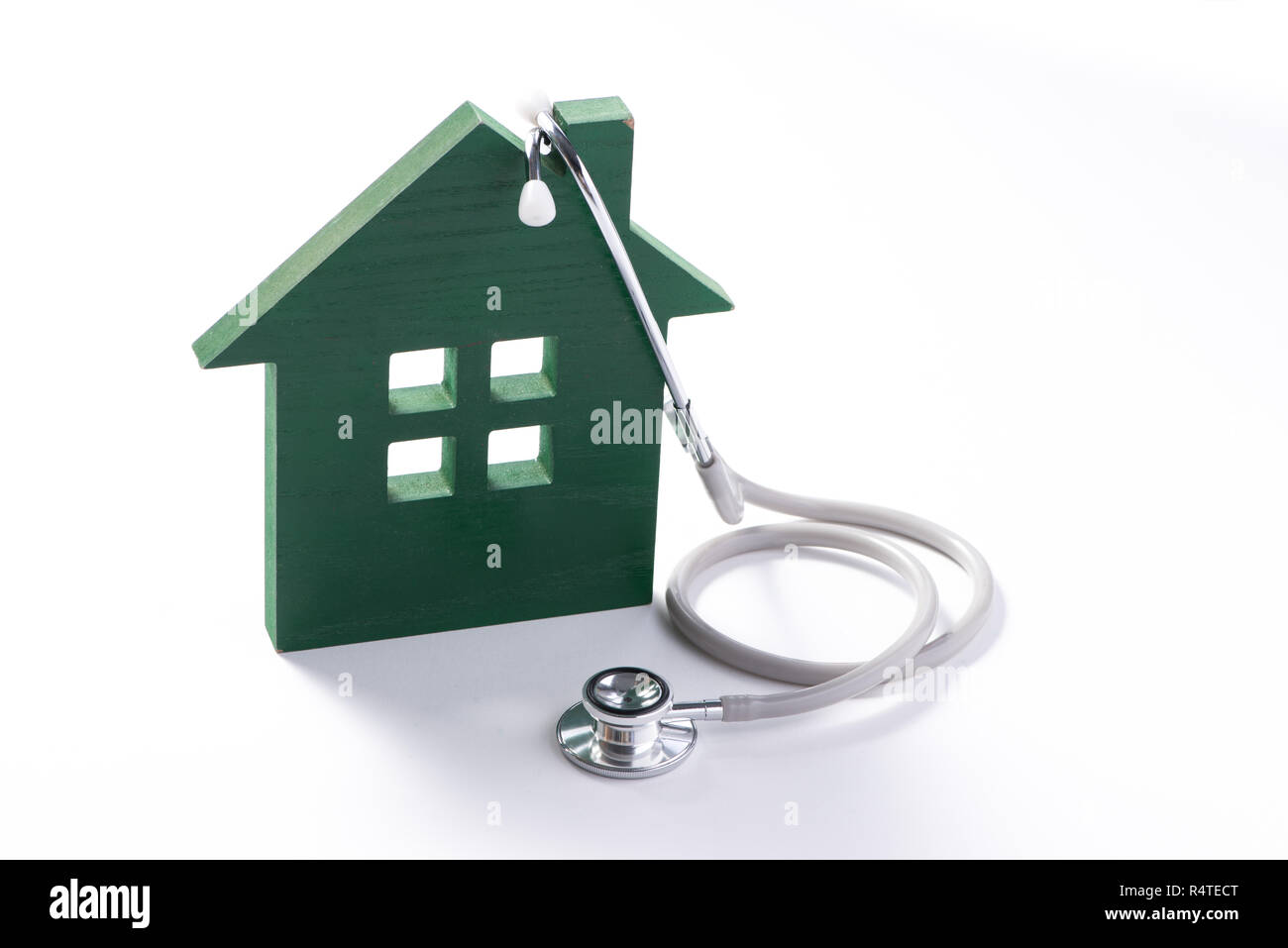 Concept of family medicine. House with stethoscope isolated on white ...