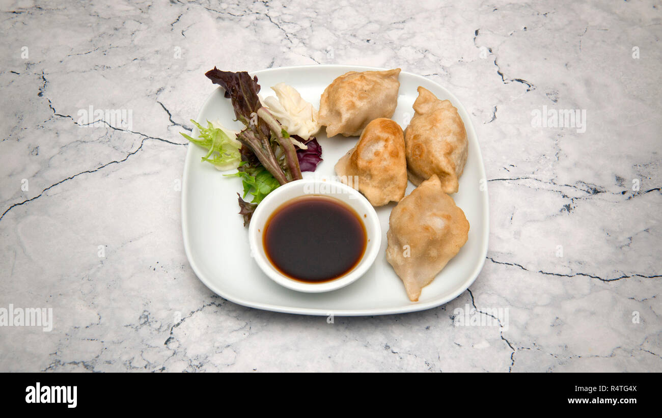 Oriental food, pork guo tie dumplings Stock Photo - Alamy