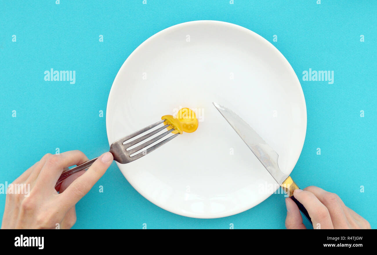 Female hands with cutlery and empty plate Stock Photo - Alamy