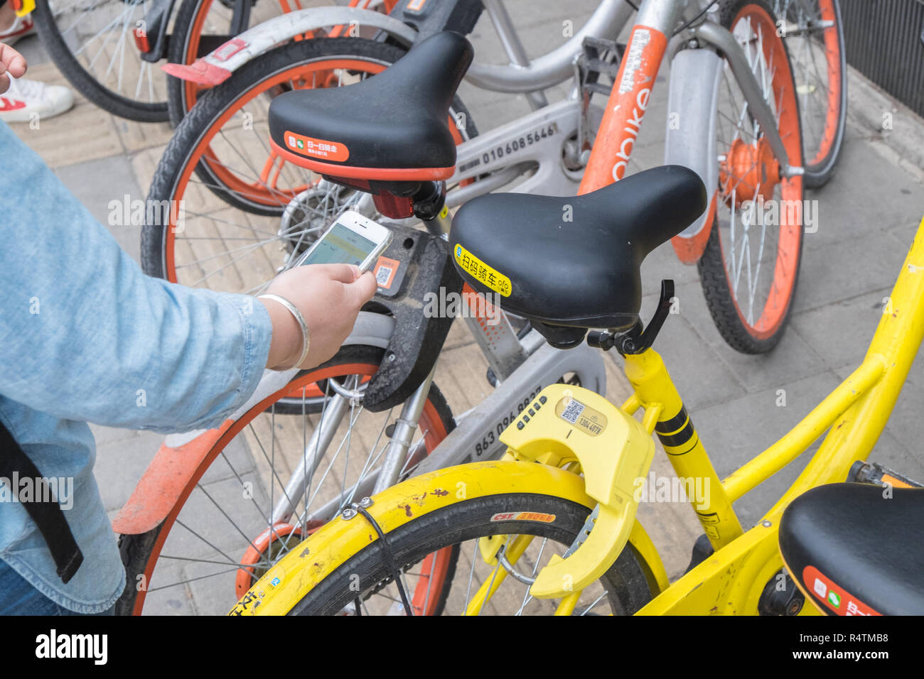 Using,mobile phone,app,to,access,dockless,bike,share,sharing,cycling ...