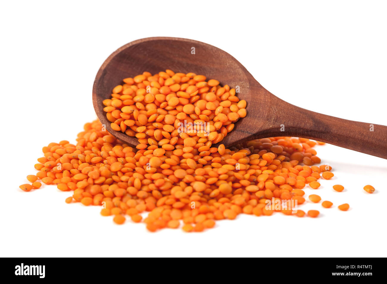 Red lentils in the wooden spoon, isolated on white background Stock Photo - Alamy