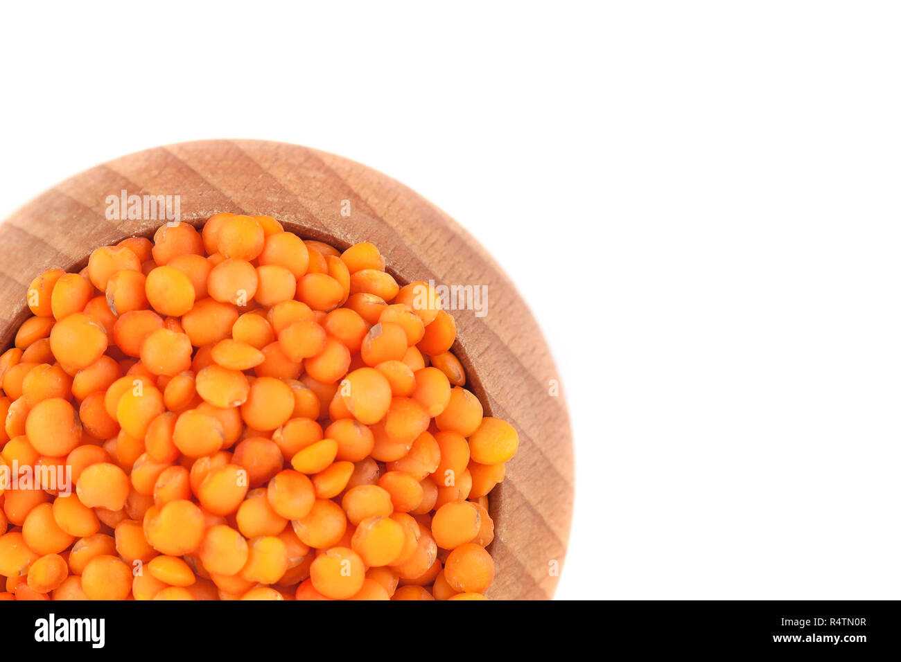 Red lentils in the wooden bowl isolated on white background Stock Photo ...