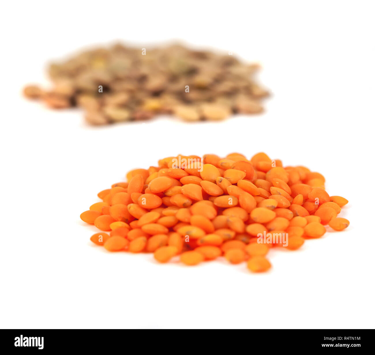 pile red and brown lentils isolated on white background Stock Photo - Alamy