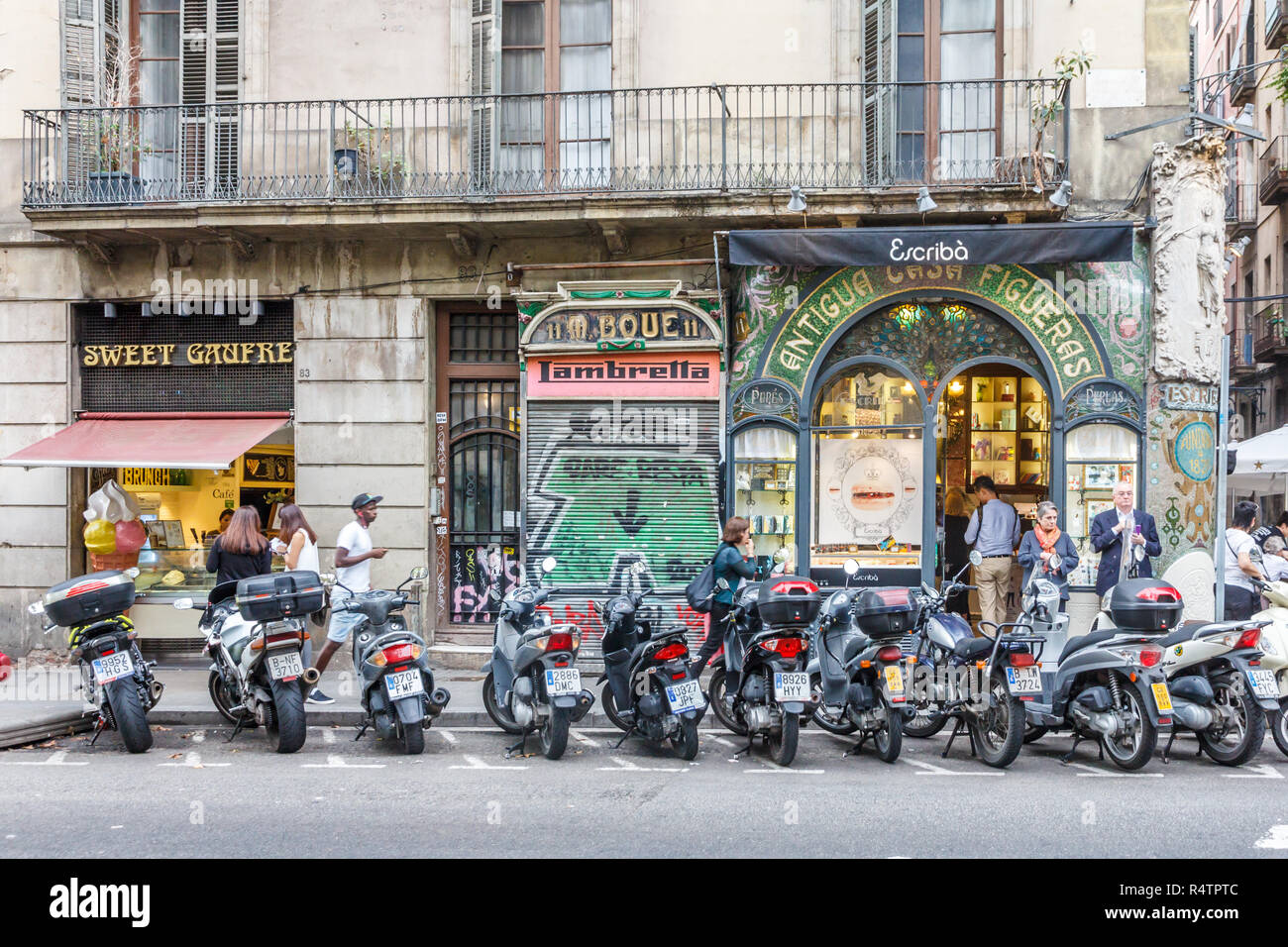 Barcelona, Spain - 4th October 2017: Motorbikes parked outside shops on ...